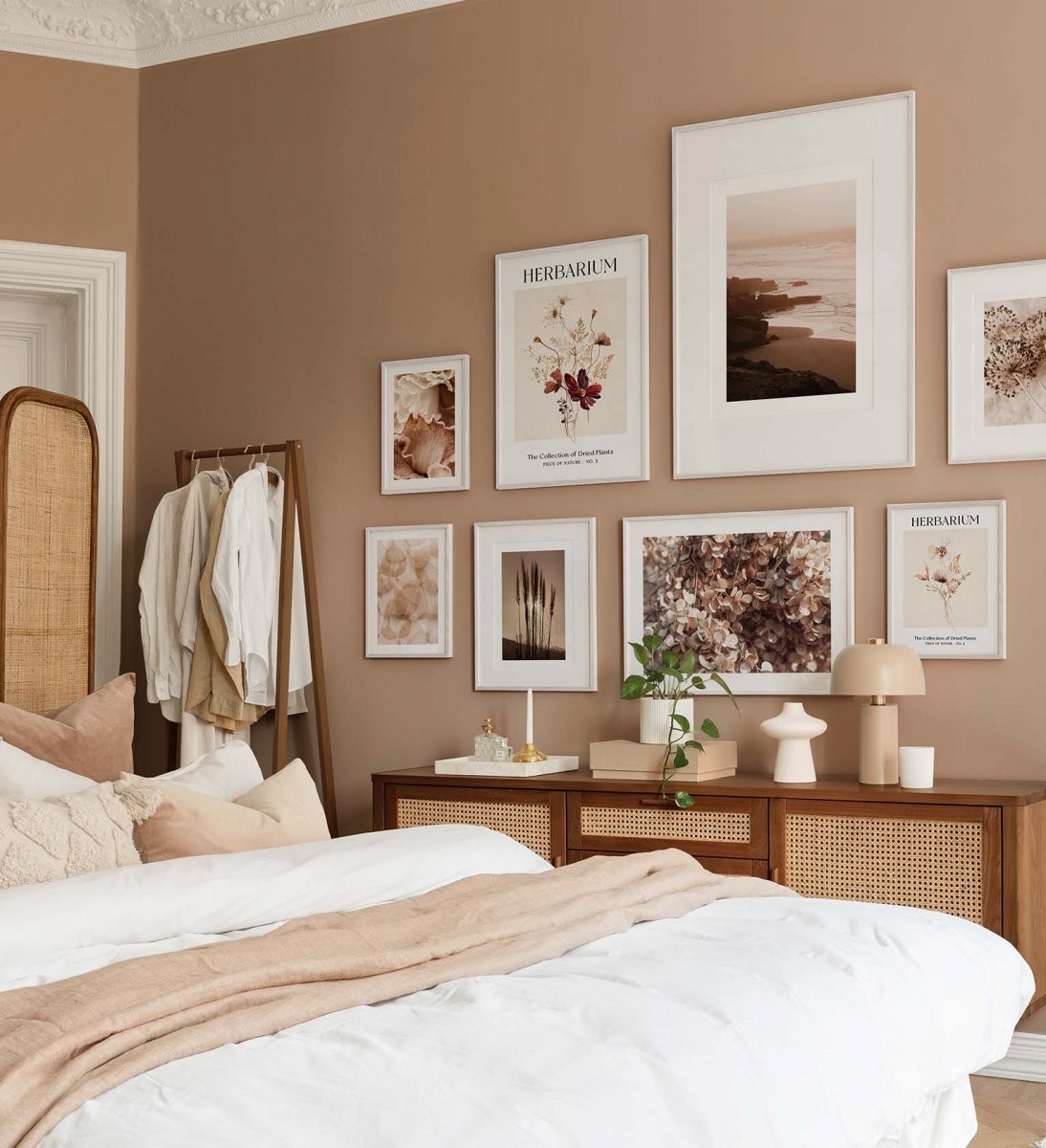 Botanical and close to nature gallery wall in brown and beige colours with white wooden frames